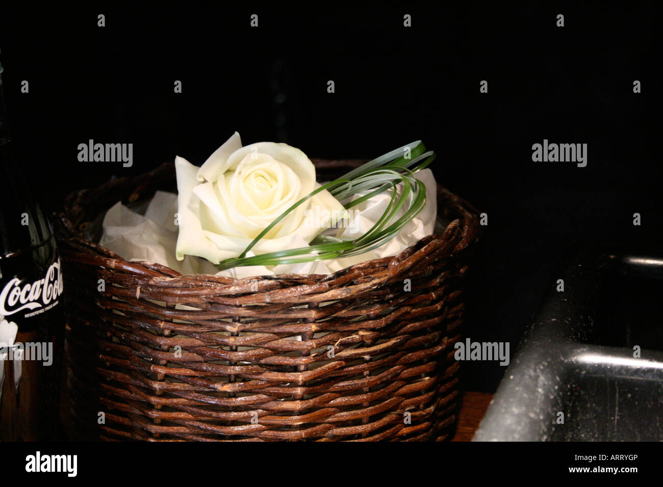 Rose on basket with Coca-Cola Stock Photo - Alamy