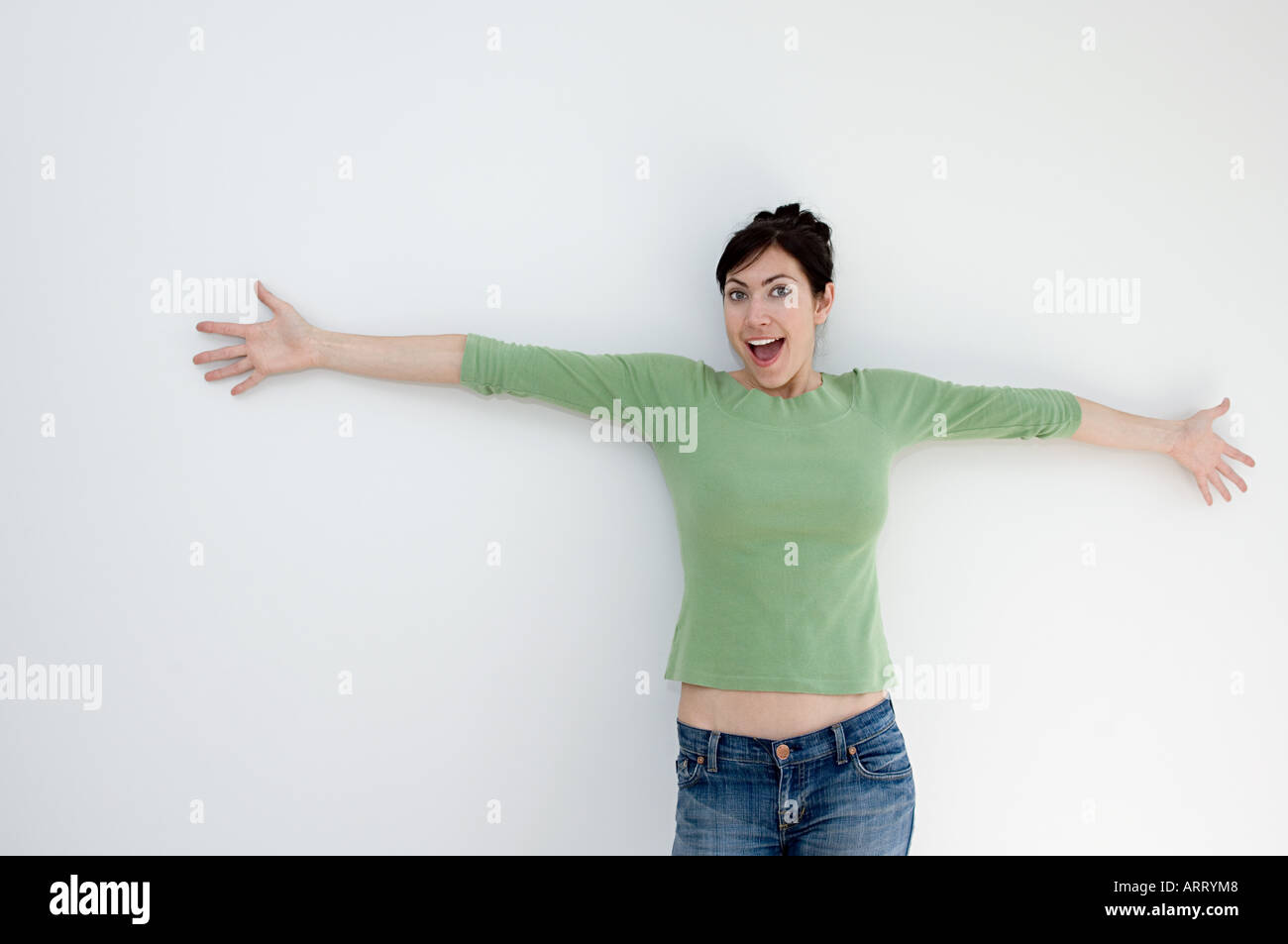 Woman with arms open Stock Photo - Alamy