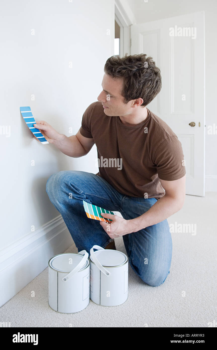 Man choosing paint colours Stock Photo - Alamy