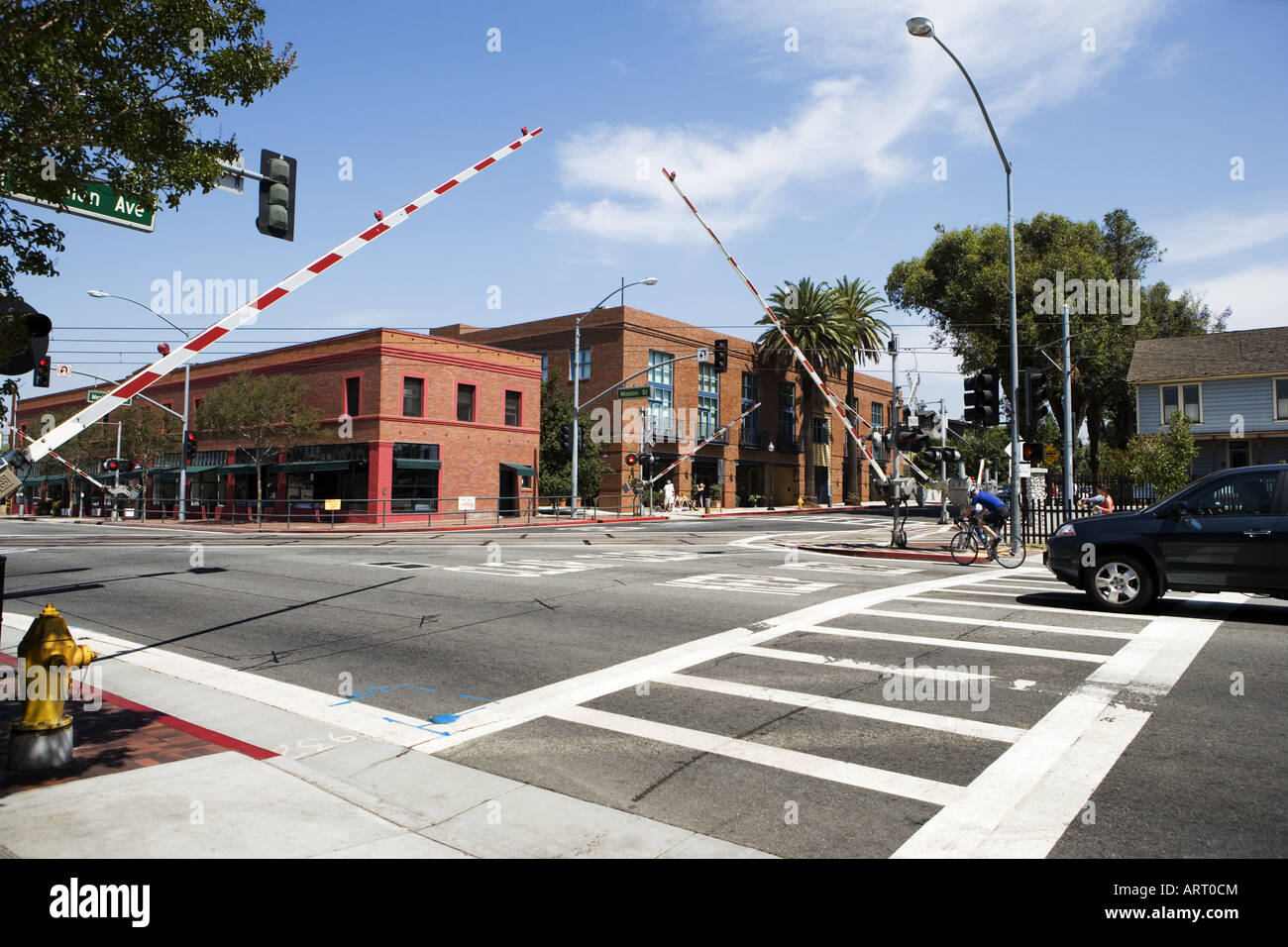 Railroad crossing gate at intersection Stock Photo - Alamy