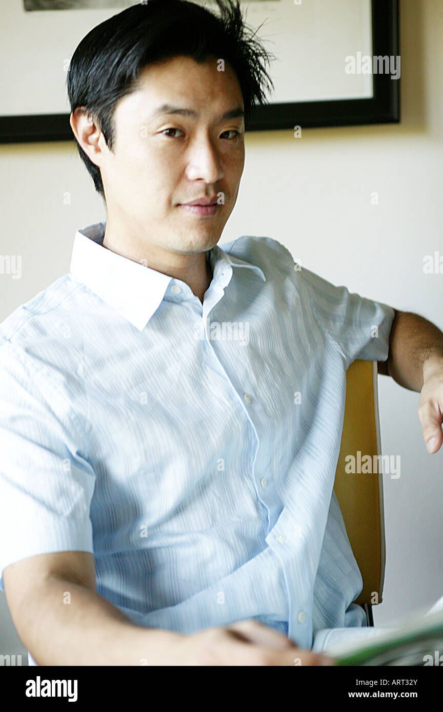 Asian man newspaper hi-res stock photography and images - Alamy