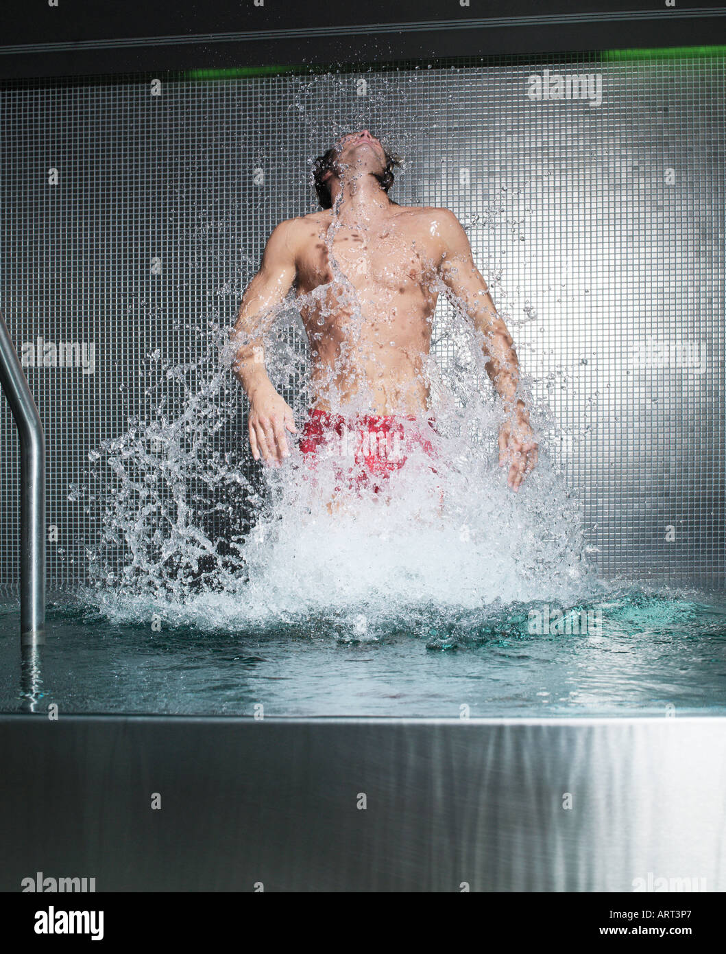 Man jumping in swimming pool Stock Photo - Alamy
