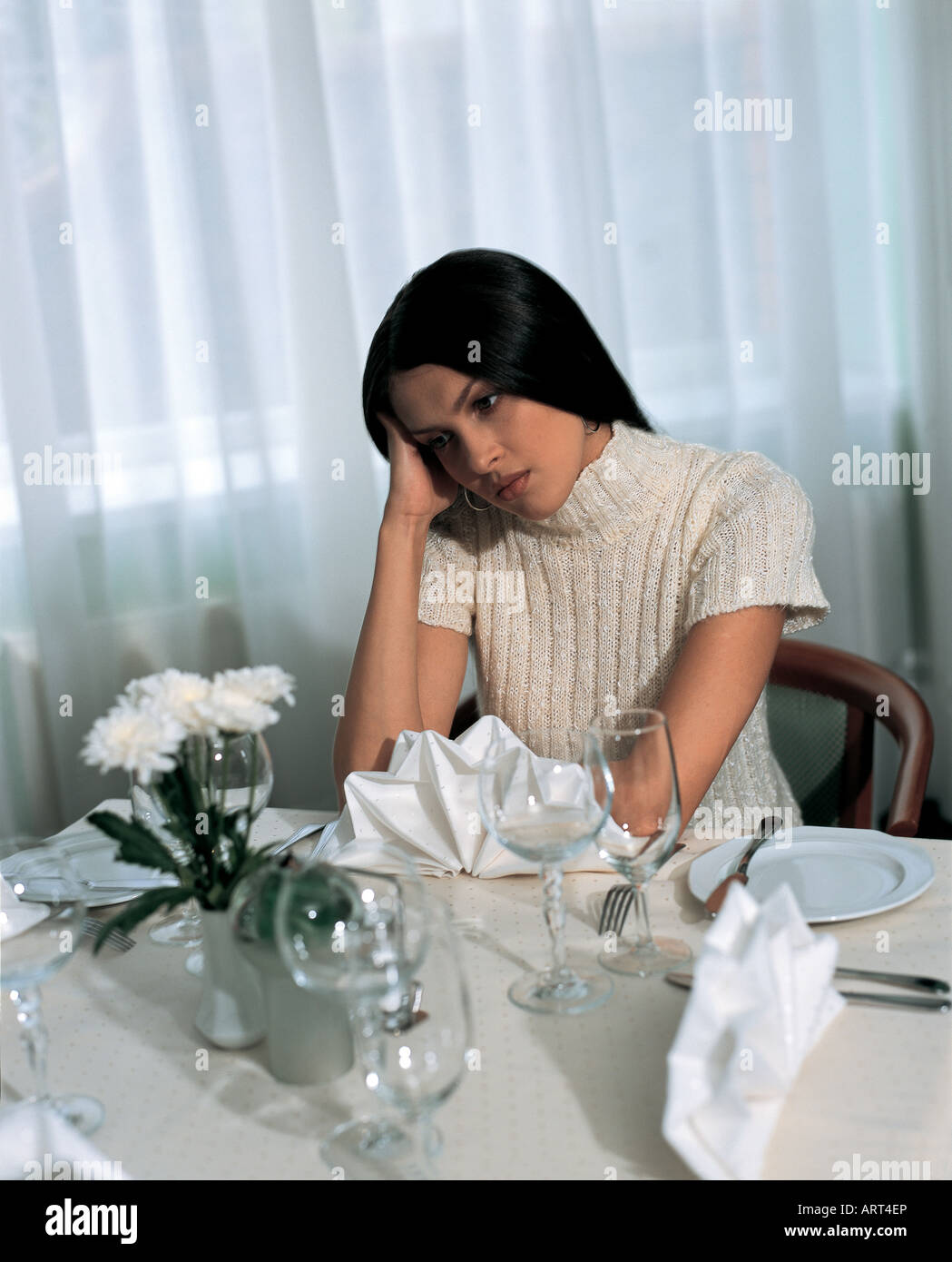 Woman waiting in a restaurant Stock Photo - Alamy