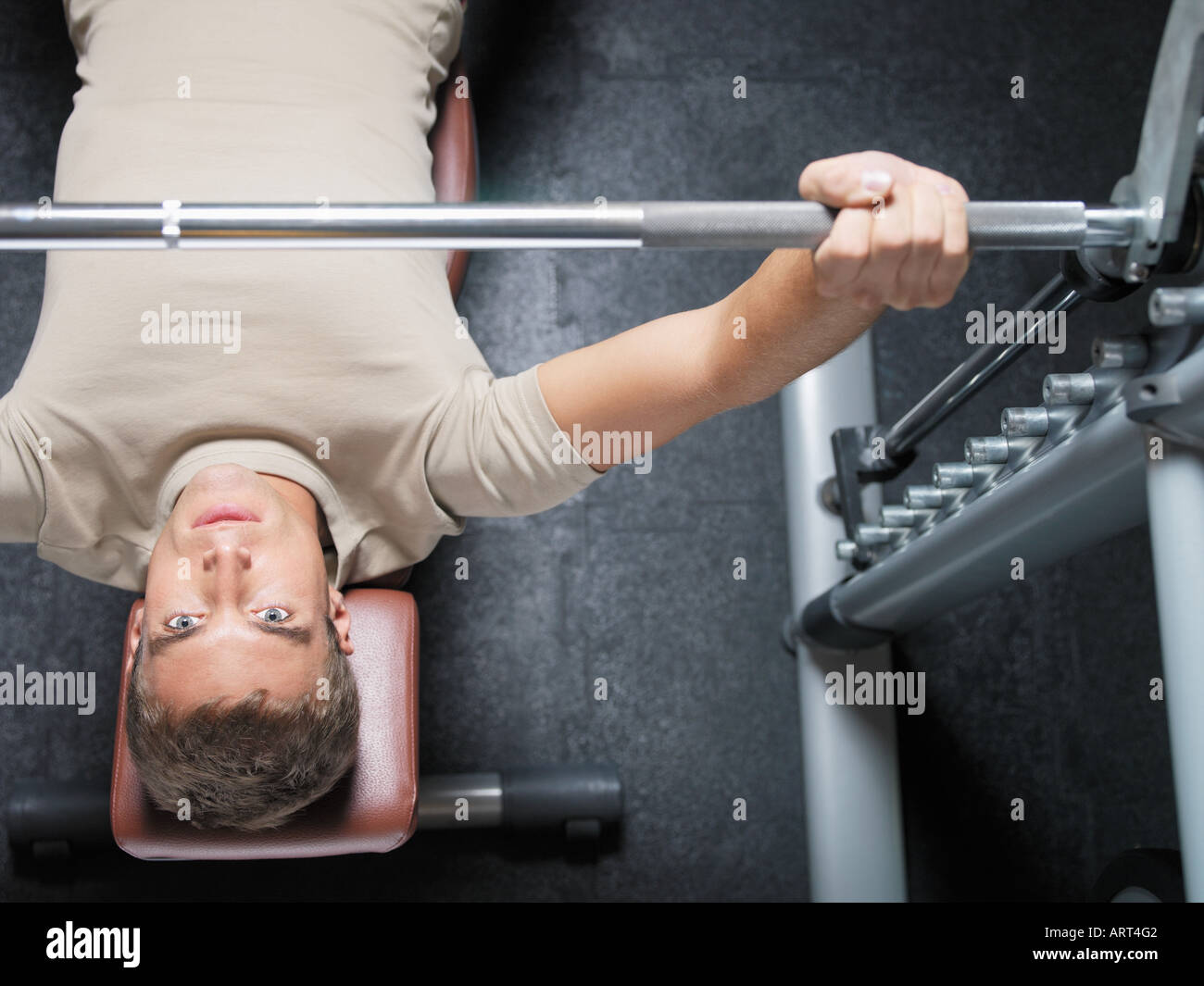 Young man lifting gear hi-res stock photography and images - Alamy