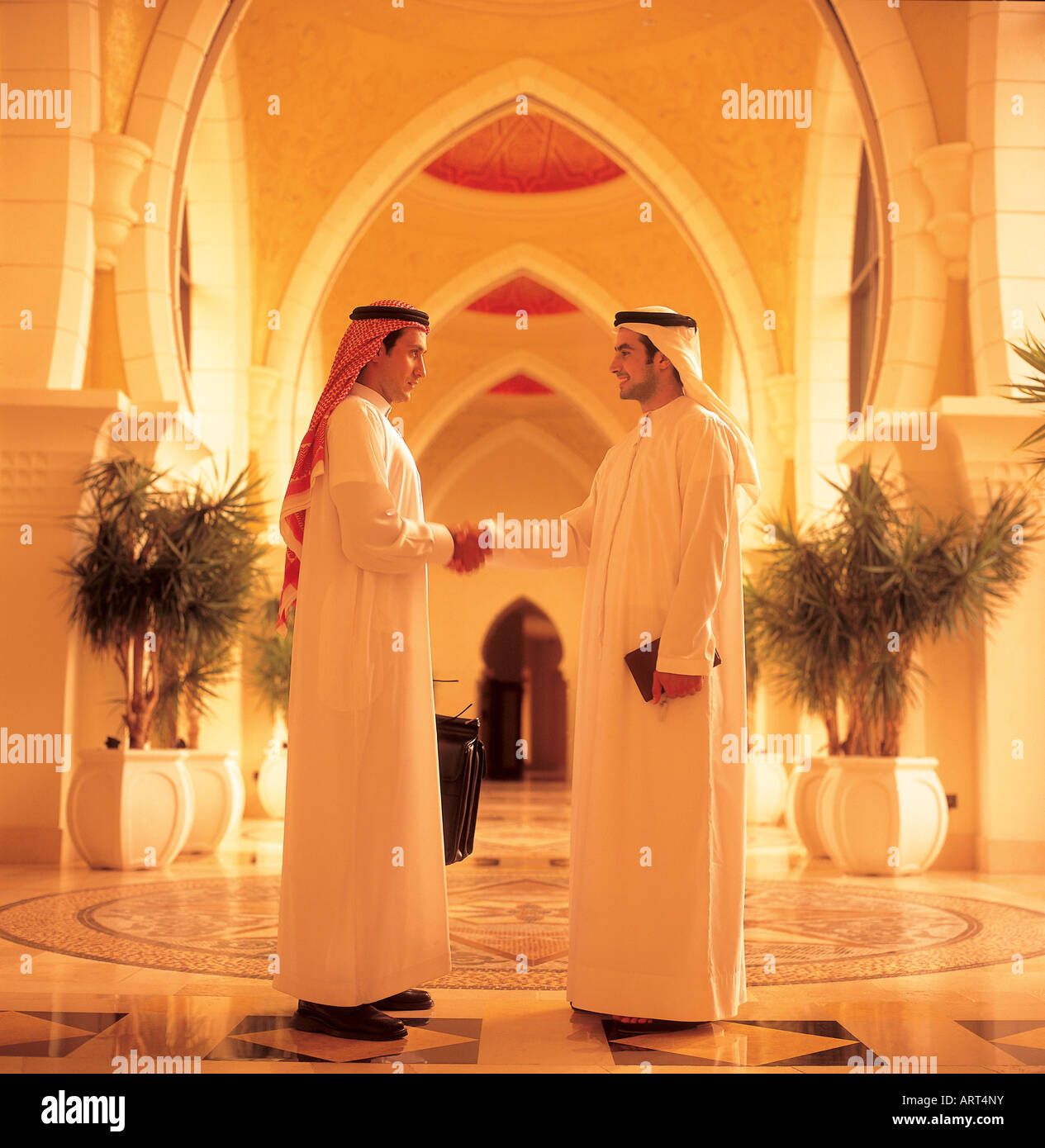 Handshake between Arab businessmen Stock Photo - Alamy