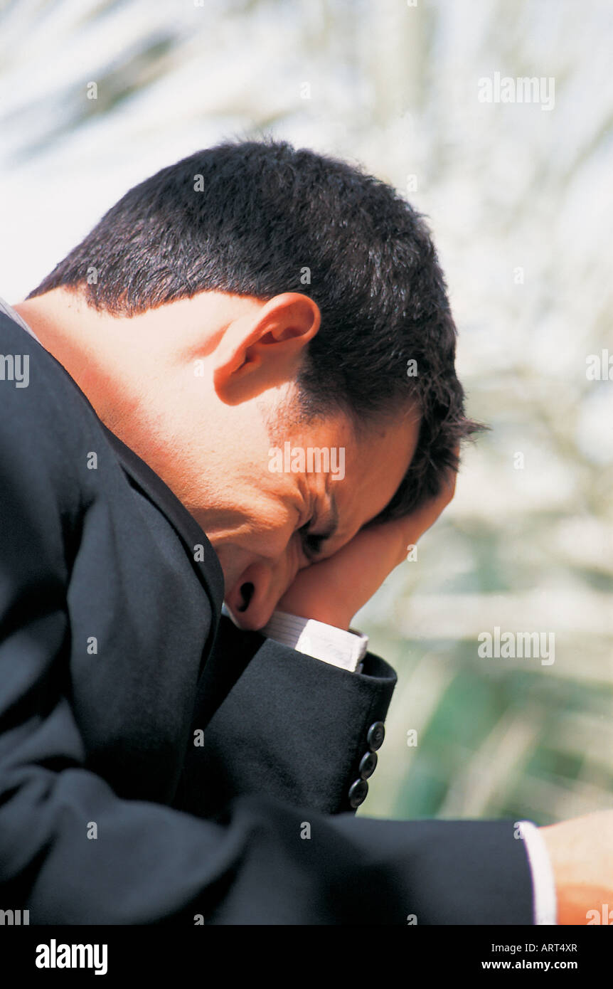 Businessman holding his head Stock Photo - Alamy Businessman holding his head Stock Photo - Alamy