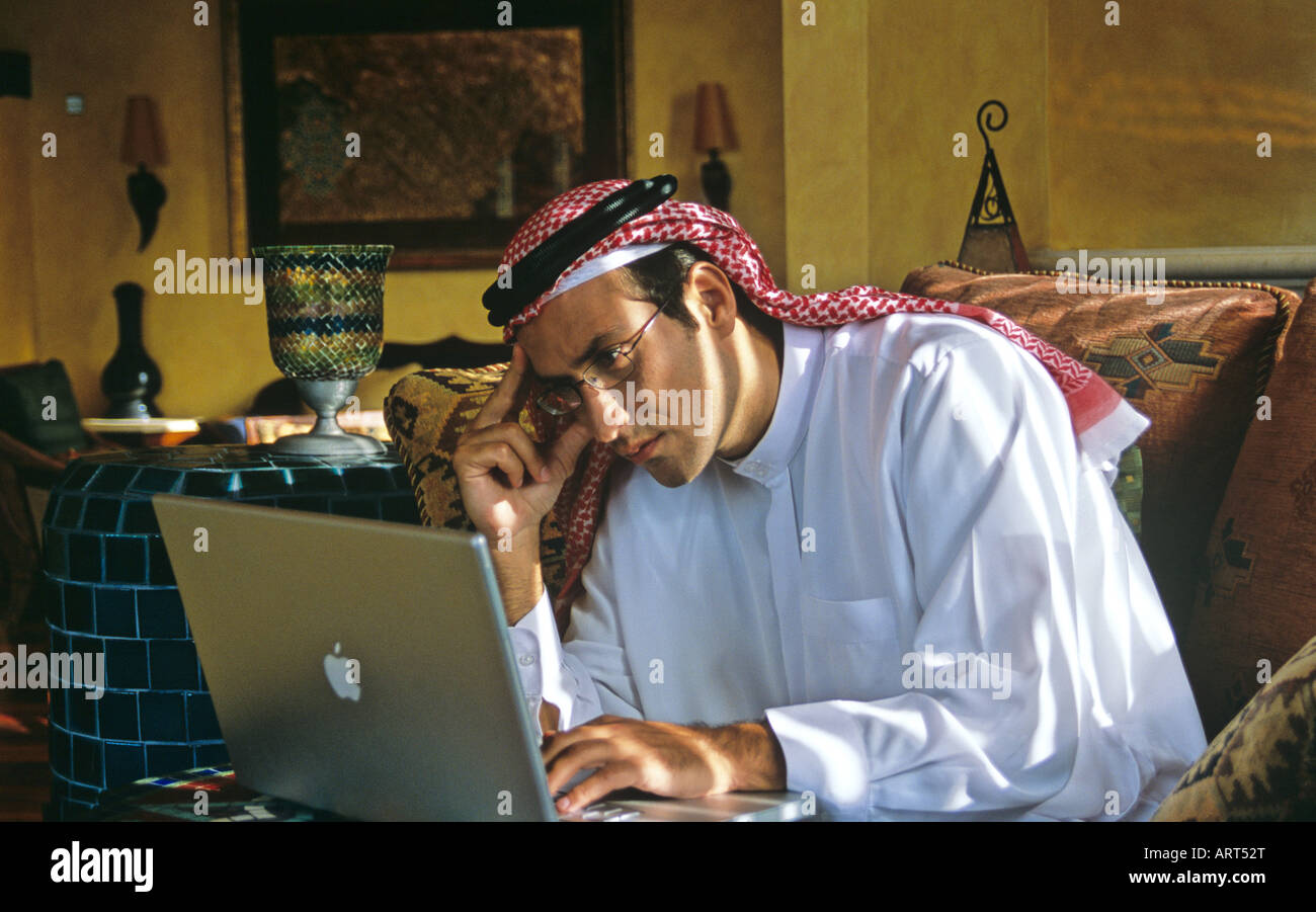 Arab man using a laptop Stock Photo - Alamy