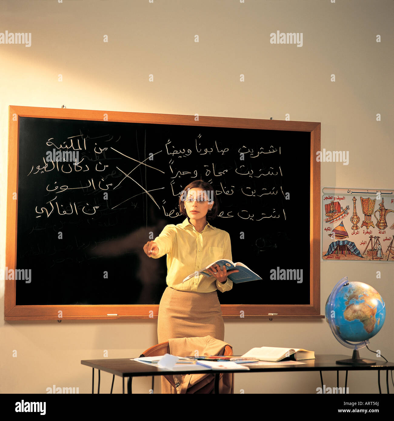 Teacher in classroom Stock Photo - Alamy