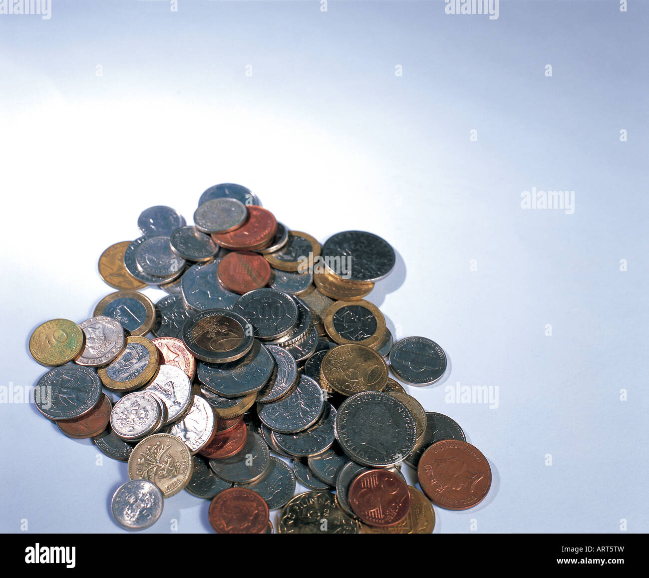 Pile of coins of various international currencies Stock Photo - Alamy