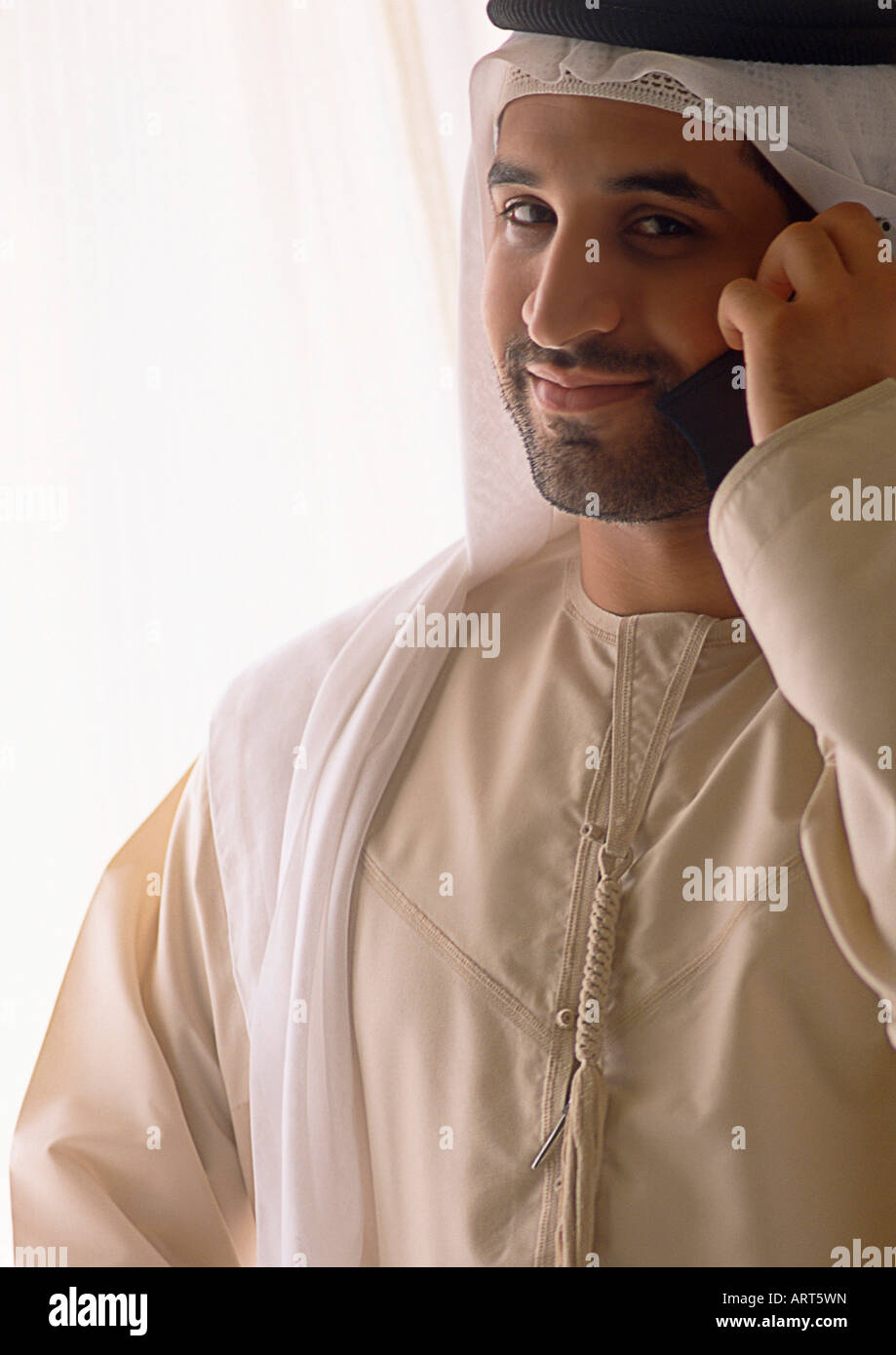 Arab businessman using a mobile phone Stock Photo - Alamy
