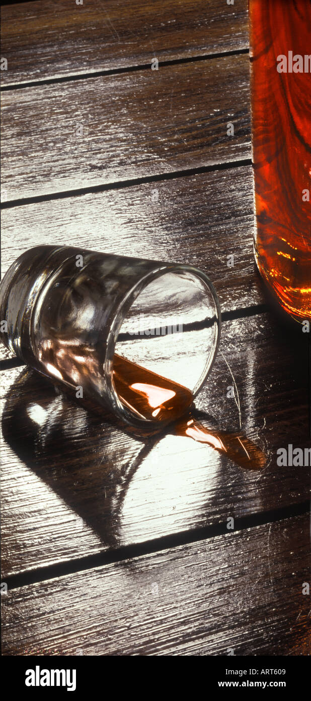 Alcohol Spilling Out Of Shot Glass By Alcoholic Alcoholism Stock Photo ...