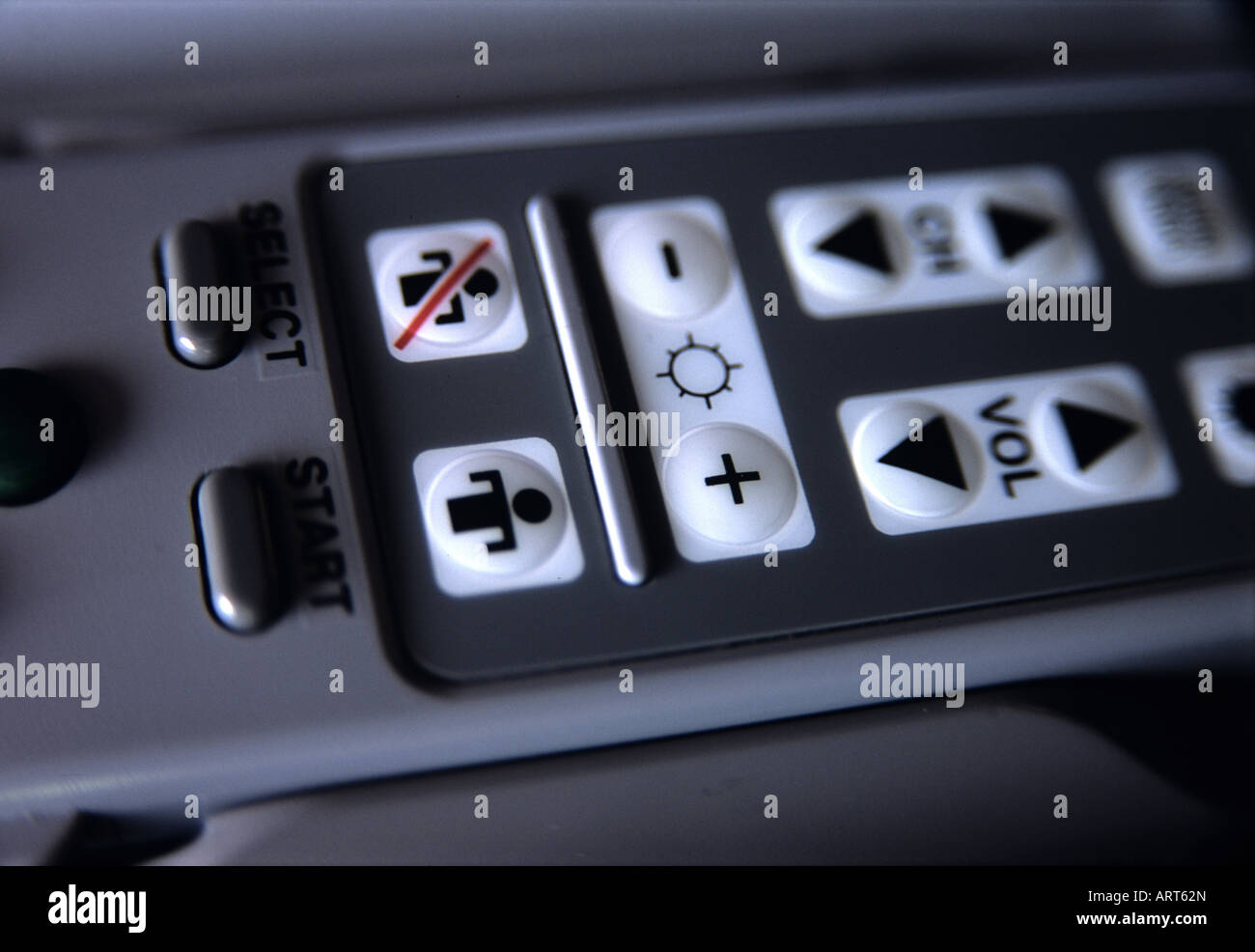 Passenger remote control on airplane Stock Photo - Alamy