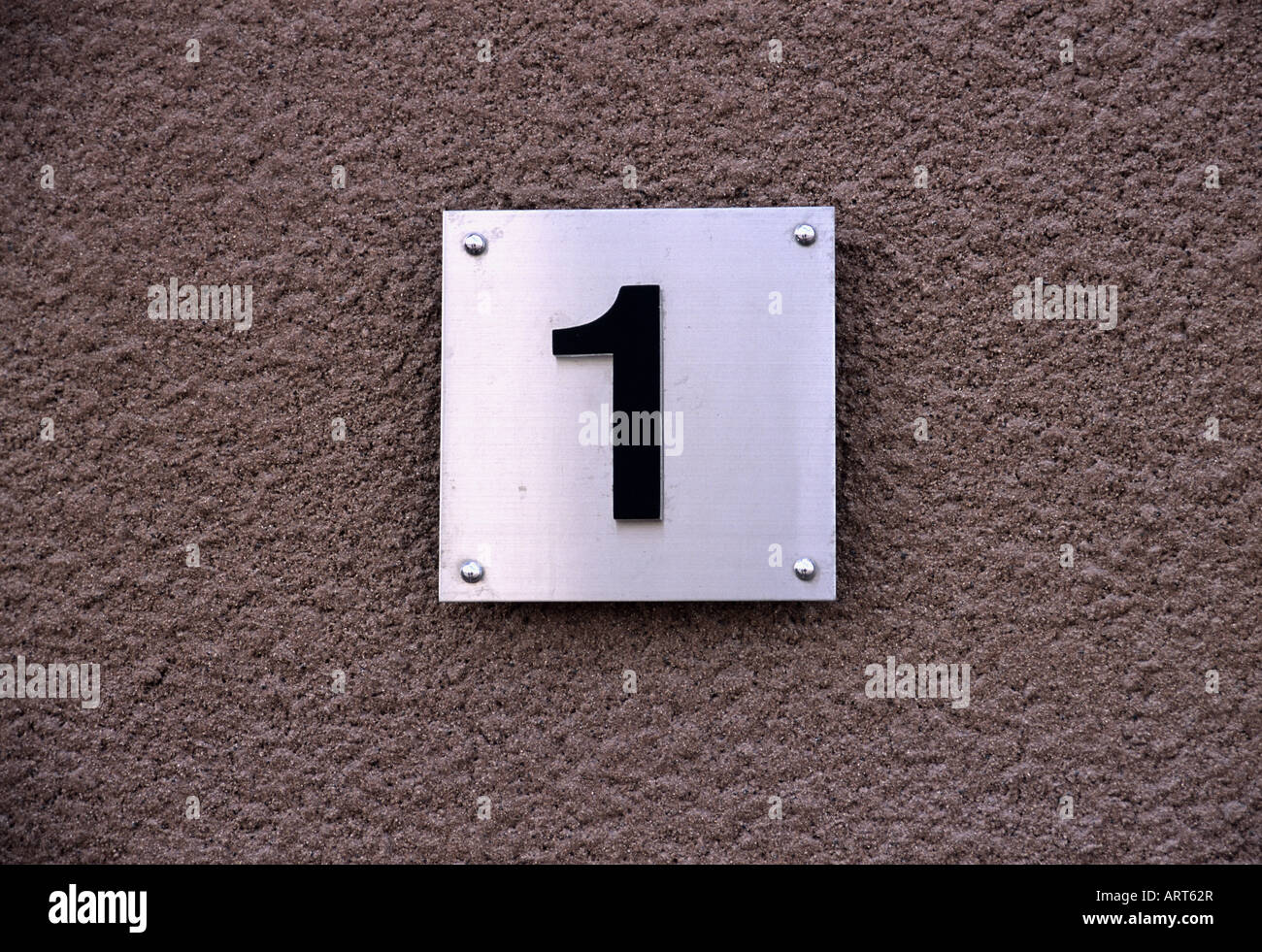 Number One plate on a wall Stock Photo - Alamy