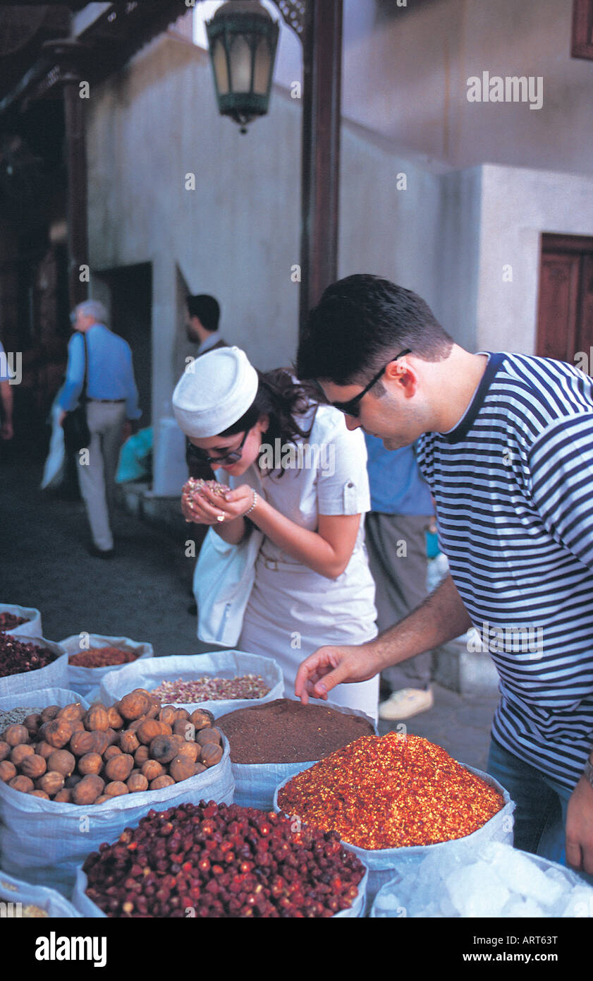 Western tourists smelling exotic spices on the spice market in Dubai ...