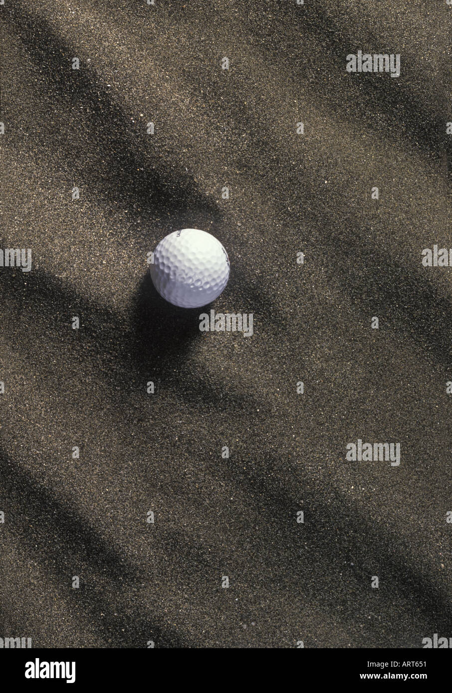 Golf Ball In Black Sand Trap Stock Photo - Alamy