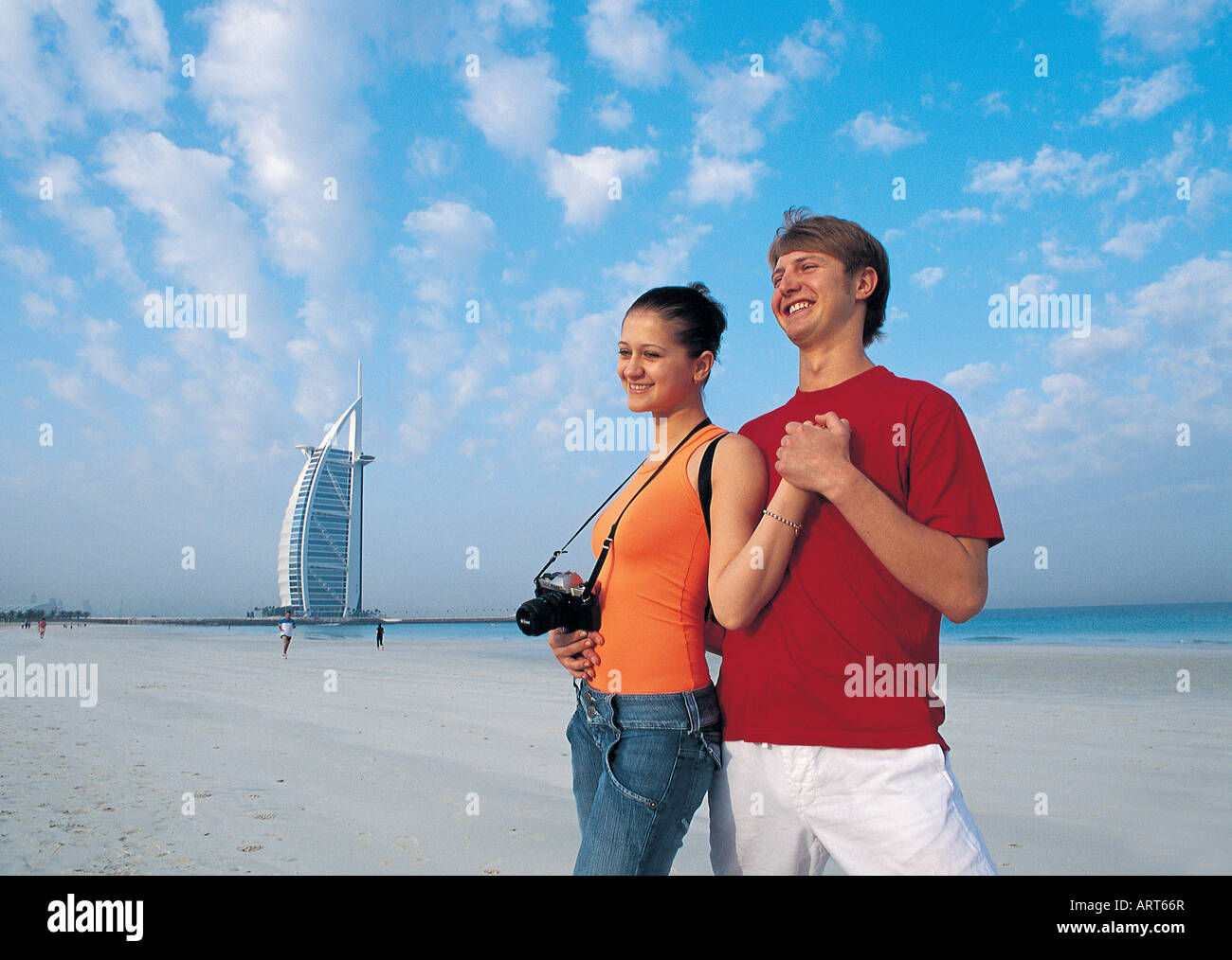 Western tourists on the beach near Burj Al Arab hotel in Dubai, UAE ...