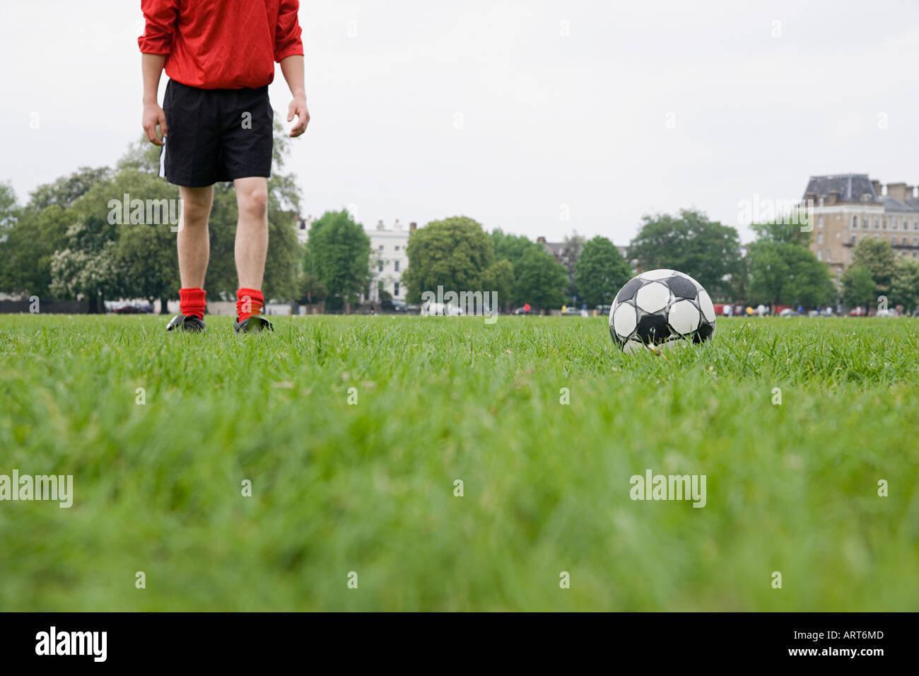 Footballer and football Stock Photo - Alamy