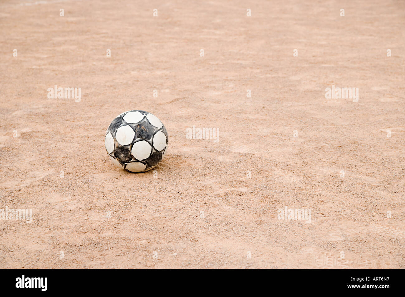 Football on gravel Stock Photo - Alamy