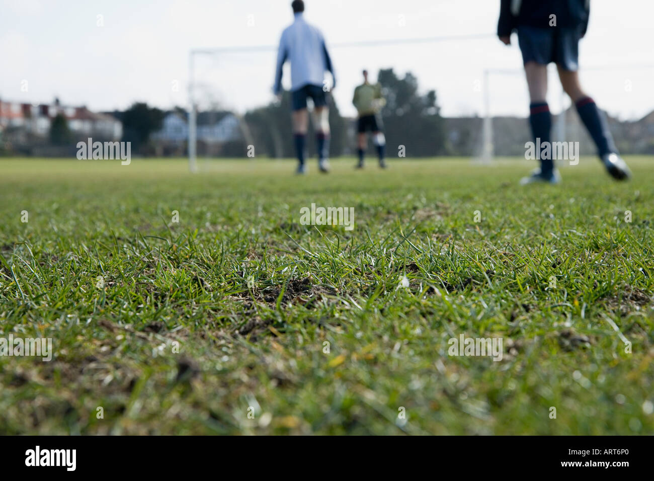 Footballers on a pitch Stock Photo - Alamy