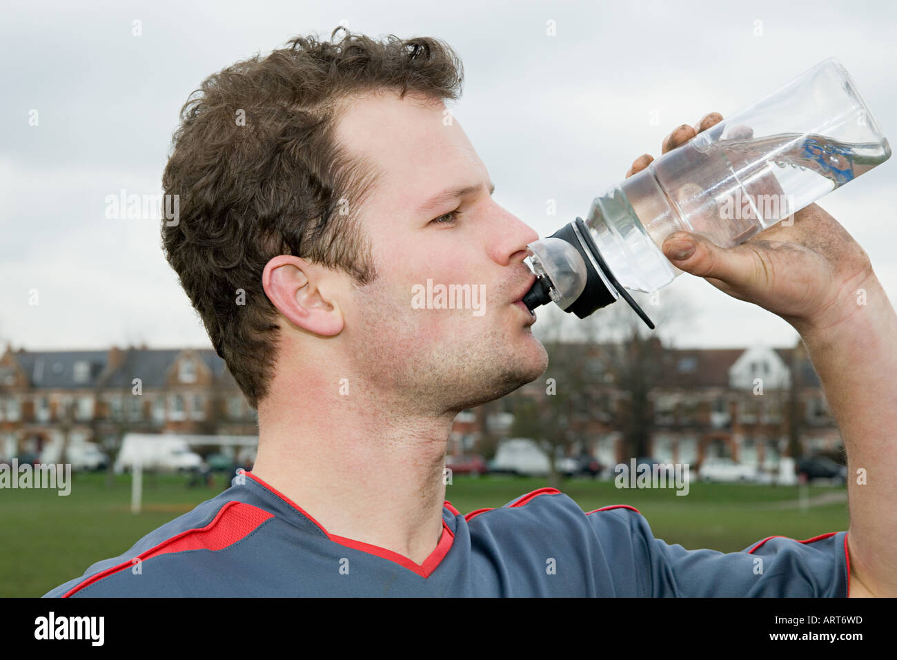 Footballer drinking water Stock Photo - Alamy