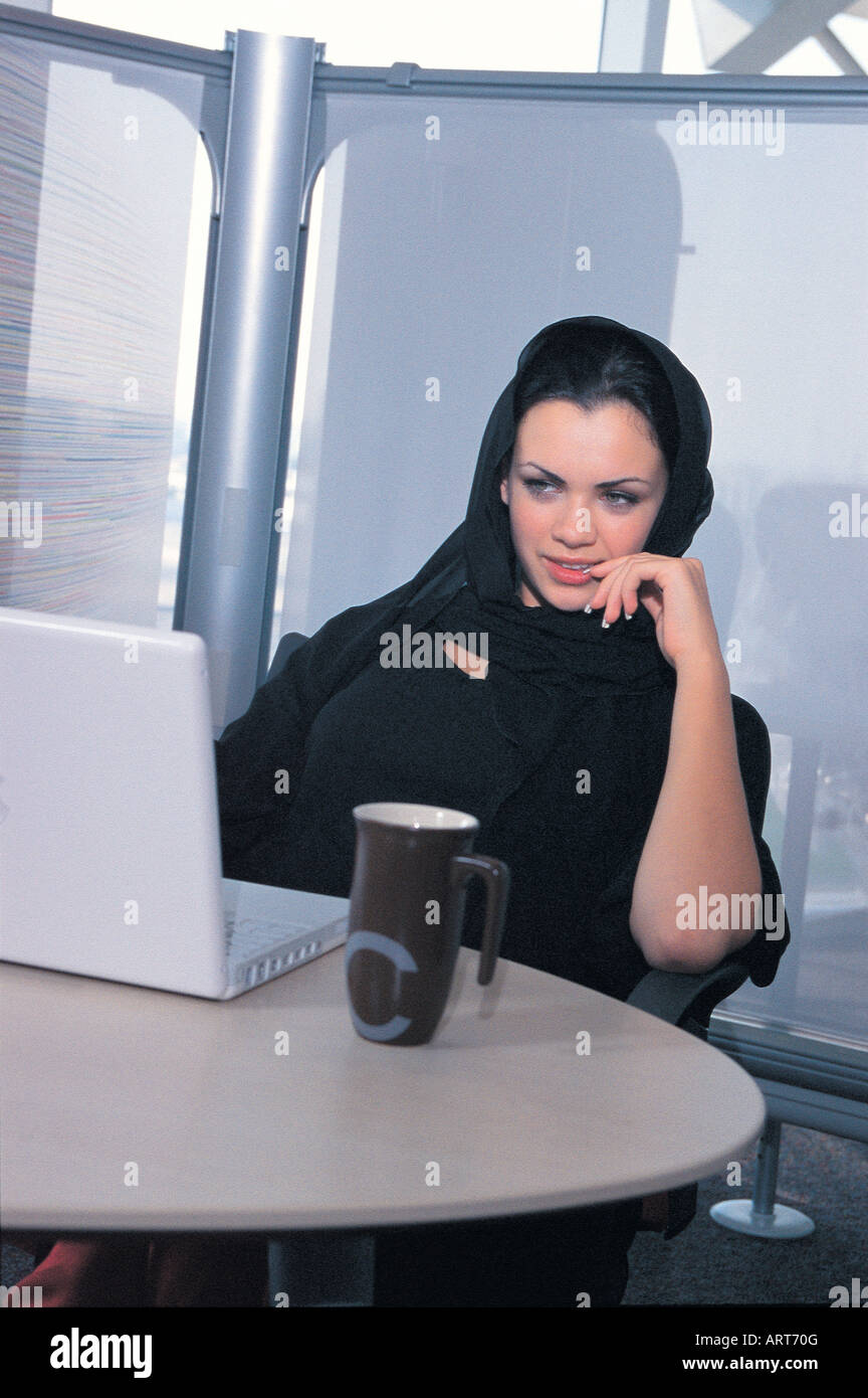 Arab businesswoman at her desk with laptop Stock Photo - Alamy