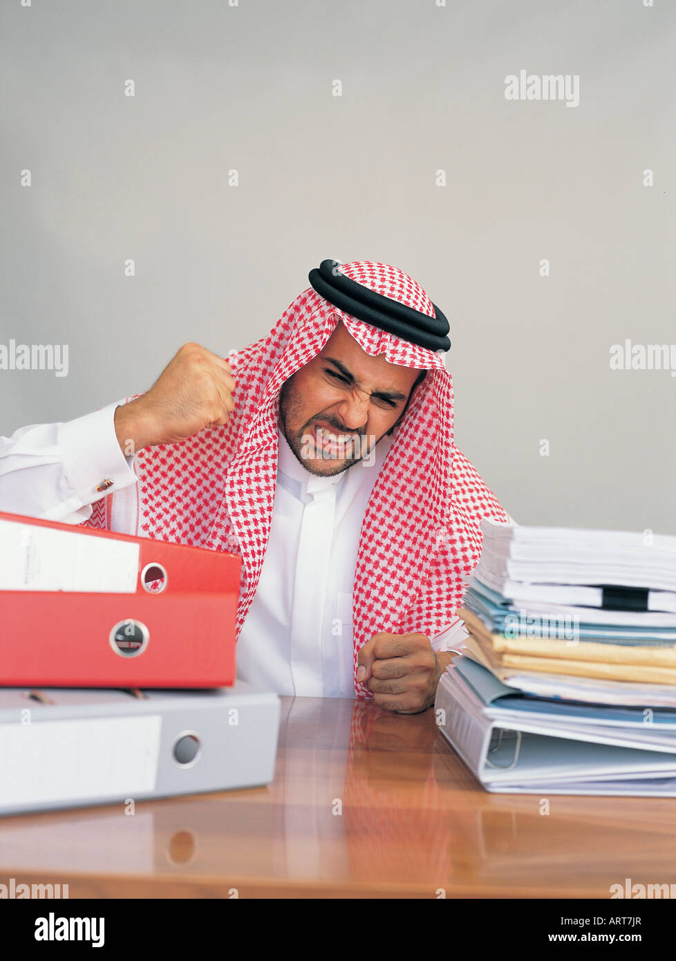 Arab businessman being angry at his desk Stock Photo - Alamy