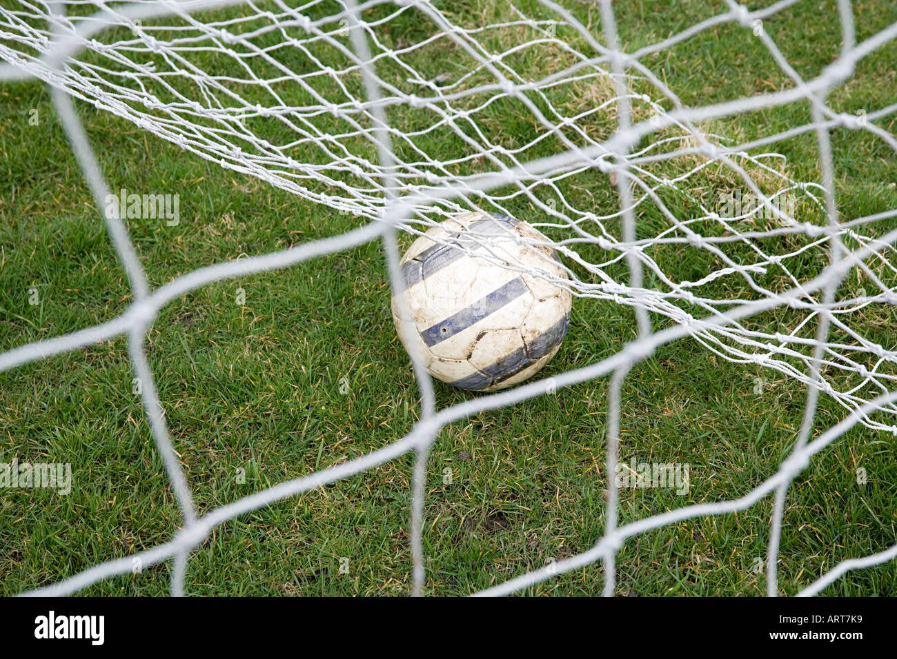Football under net Stock Photo - Alamy