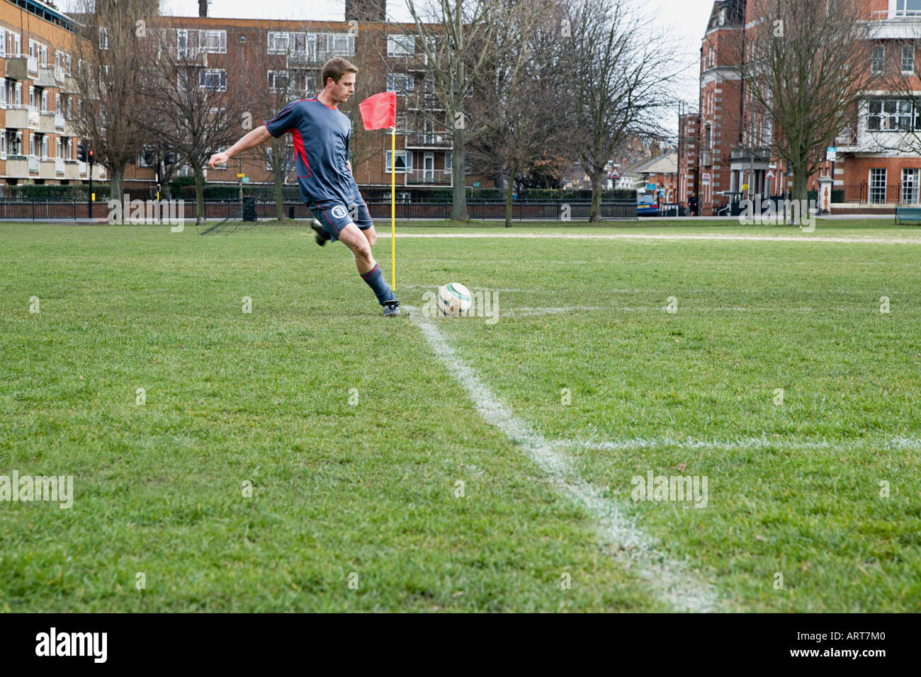 Footballer taking a corner Stock Photo - Alamy