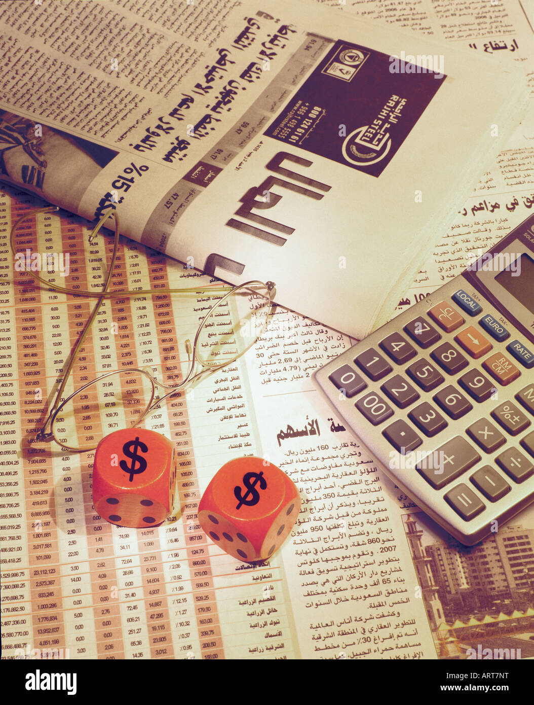 Arab newspaper, dices and calculator Stock Photo - Alamy