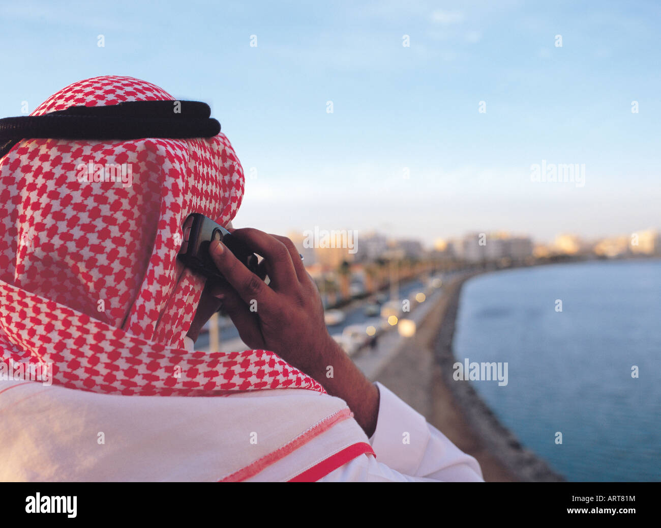 Saudi businessman using mobile phone in Jeddah, Saudi Arabia Stock ...
