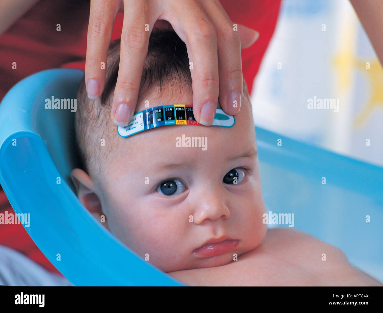 Baby with a fever Stock Photo - Alamy