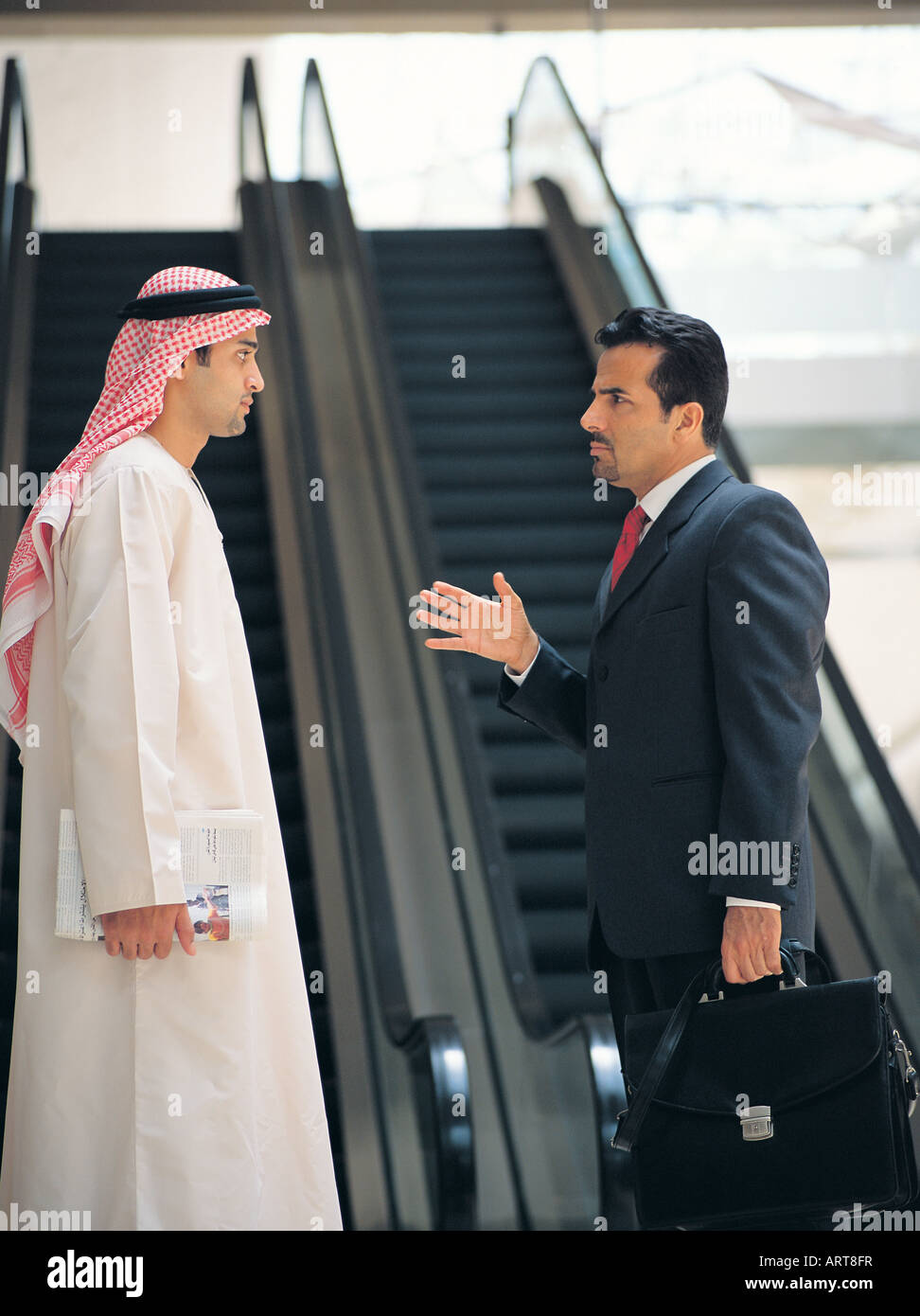 Arab businessmen having a discussion Stock Photo - Alamy