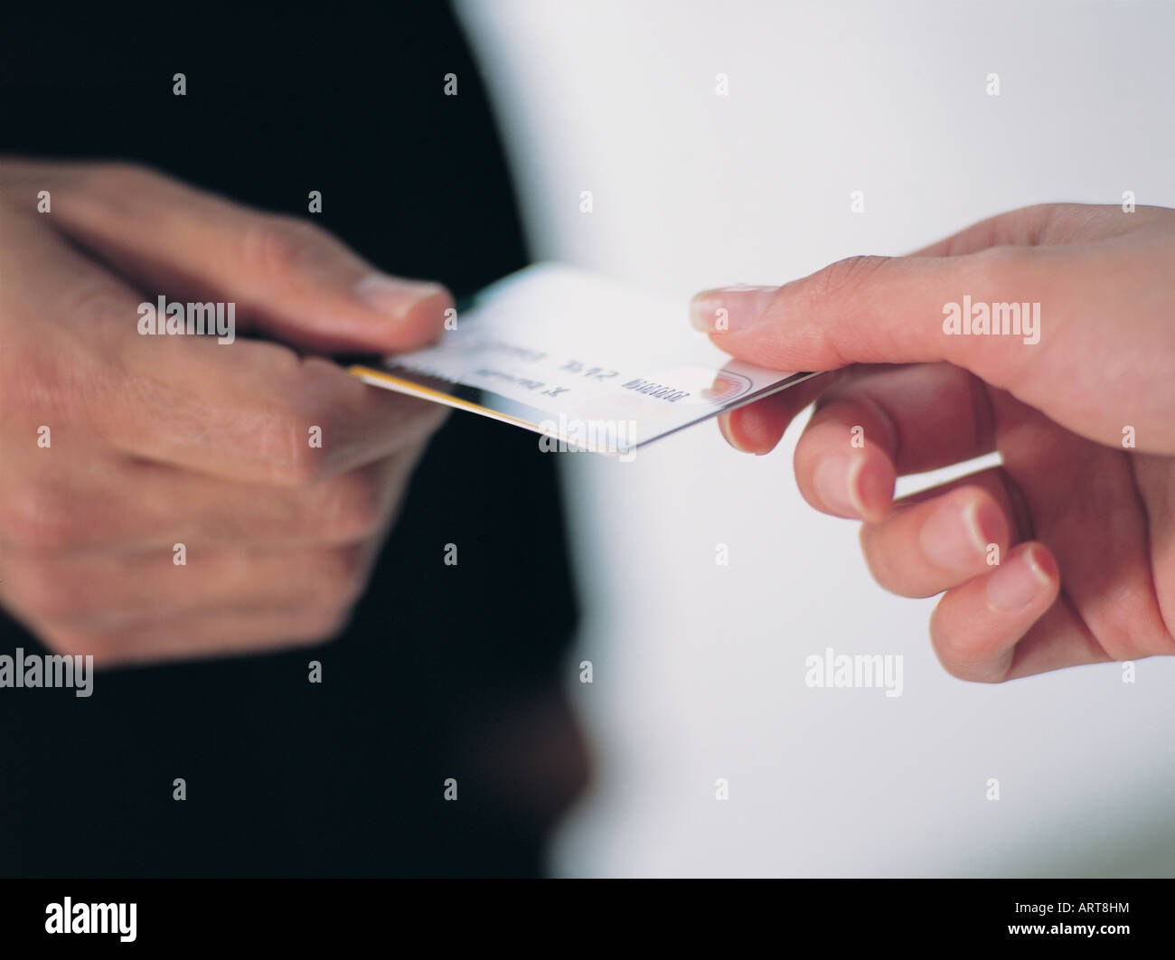 Handing over a credit card Stock Photo - Alamy