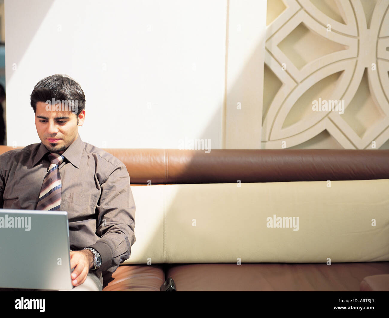 Arab businessman using laptop Stock Photo - Alamy
