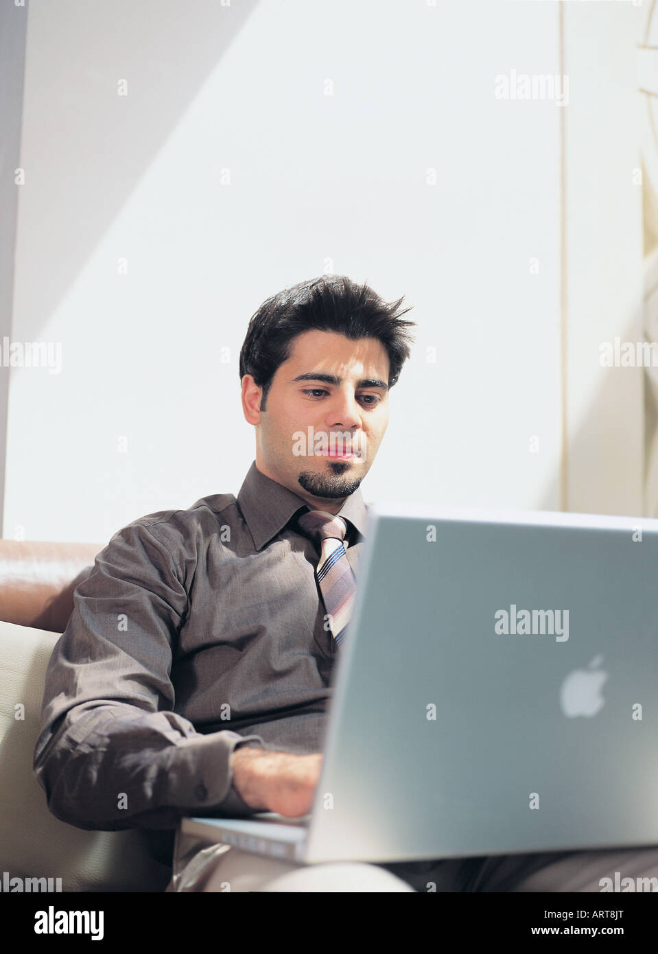 Arab businessman using laptop Stock Photo - Alamy