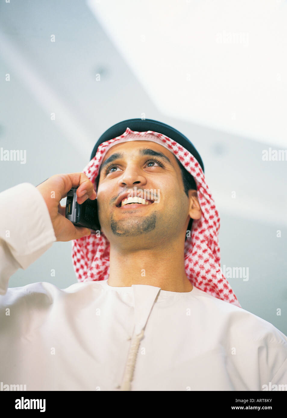 Arab man using mobile phone Stock Photo - Alamy