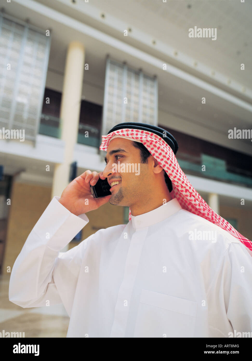 Arab man using mobile phone Stock Photo - Alamy