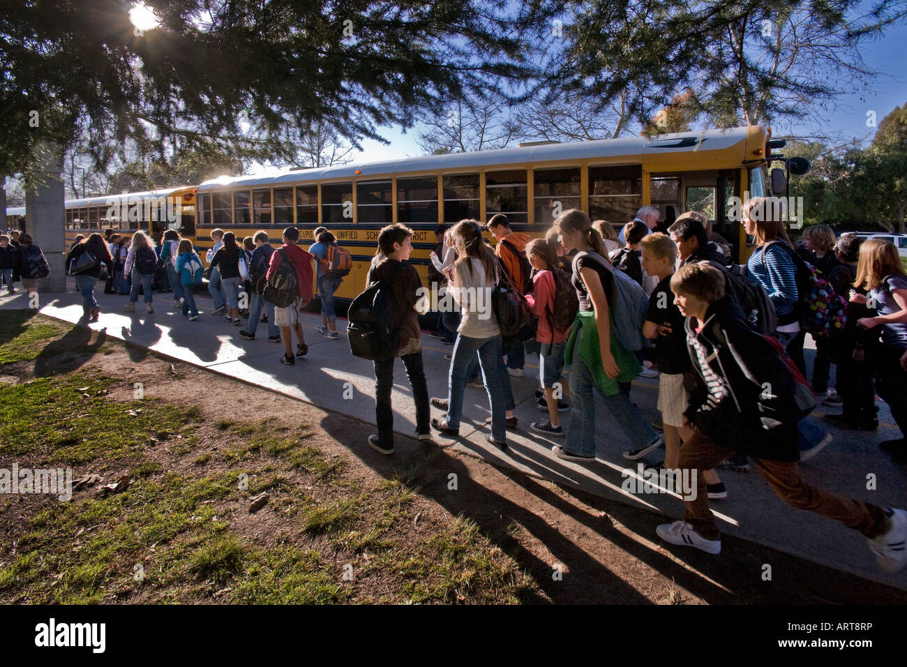 California middle school students walk to buses Stock Photo - Alamy
