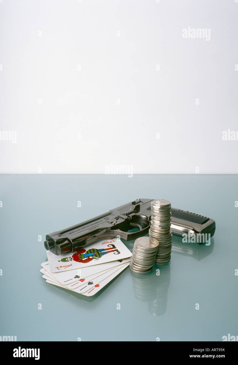 Gun, Cards and Coins Stock Photo - Alamy