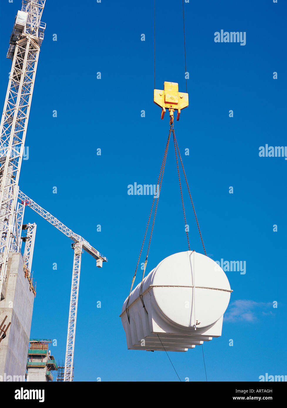 Water tank being lifted up on a construction site in Dubai, United Arab ...