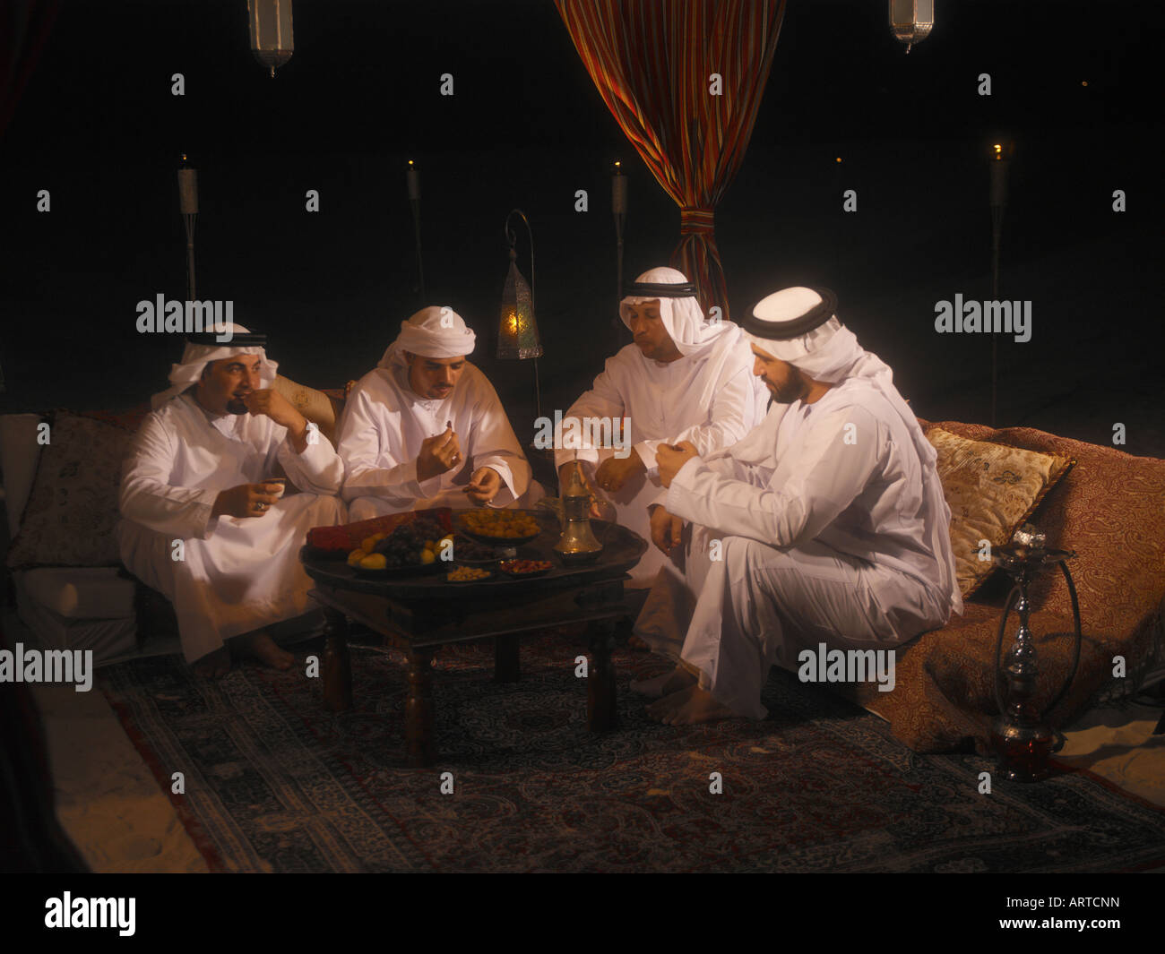 Ramadan: men sitting in Arabian tent for Iftar (fast-breaking meal ...