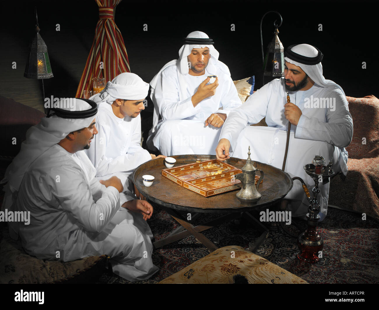Arab men playing backgammon in Arabian tent Stock Photo - Alamy
