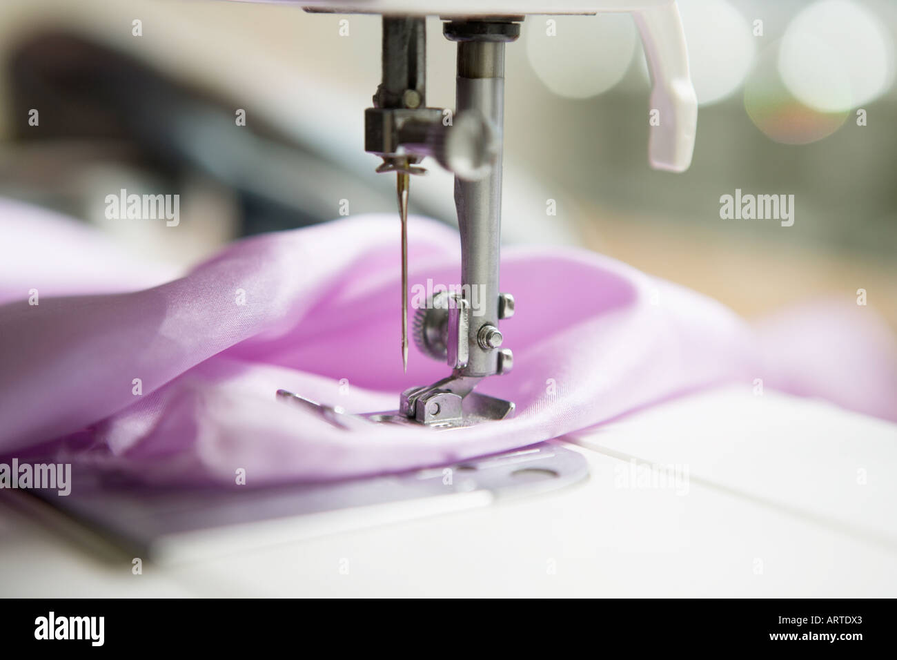 Sewing machine in purple fabric hi-res stock photography and images - Alamy