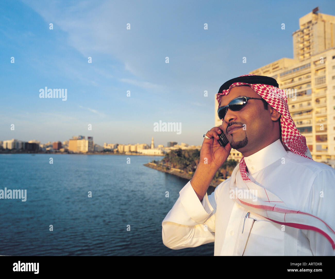 Saudi businessman using mobile phone in Jeddah, Saudi Arabia Stock ...