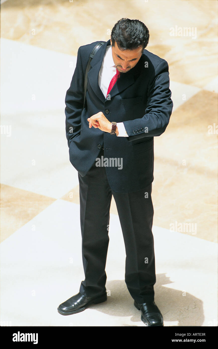Arab man checking time hi-res stock photography and images - Alamy
