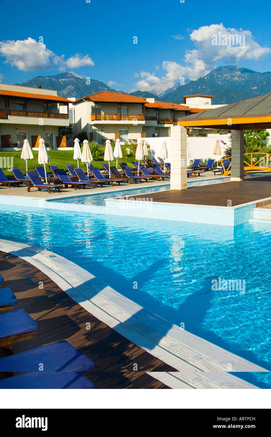 Pool area with blue lounge chairs at the Dion Palace Resort in Litohor ...
