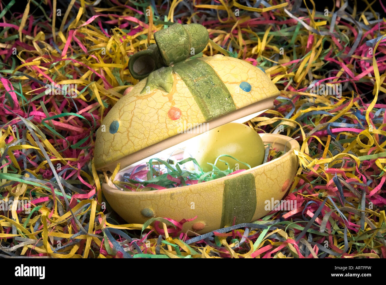 A ceramic easter egg opens up to display a lighted egg inside Stock ...