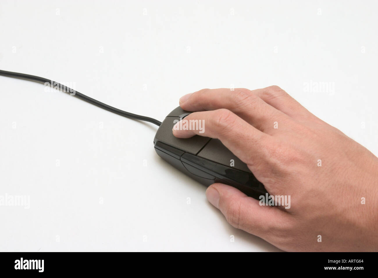 closeup of hand using black mouse on white background Stock Photo - Alamy