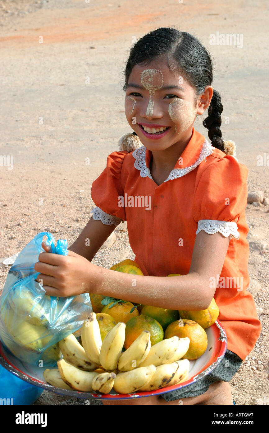 Young Burmese fruit seller wearing thanakha at Kyaikto, Lower Burma ...