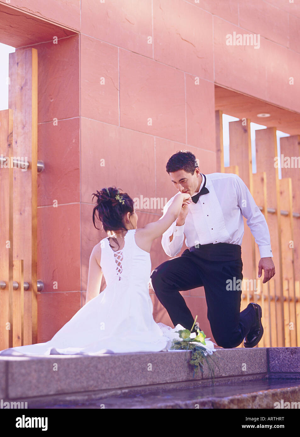 Groom kneeling bride hi-res stock photography and images - Alamy